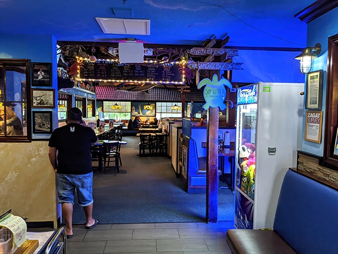 Step inside and the blue-tinted lighting instantly transports you underwater, where nautical nostalgia meets down-home comfort in this beloved Orlando institution.