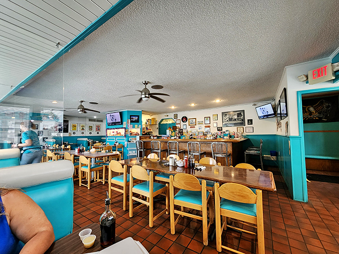 Counter seating, wooden tables with turquoise cushions, and walls adorned with memorabilia&mdash;this isn't retro cosplay, it's the real deal preserved.