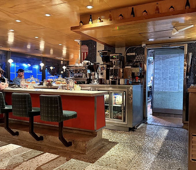 Counter culture at its finest &ndash; where the warm wood ceiling, retro stools, and bustling kitchen create the perfect backdrop for your morning coffee ritual.