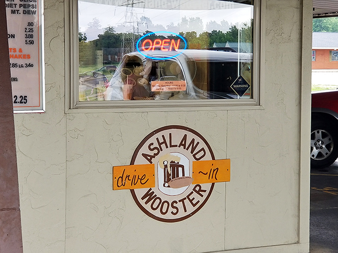 The service window where time travel begins. One order here and suddenly you're back in an era when "social media" meant talking through your car window.