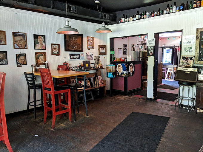 Step inside and you're greeted by vintage portraits, industrial lighting, and red chairs that say, "Sit down, stay awhile, we've got stories to tell." 