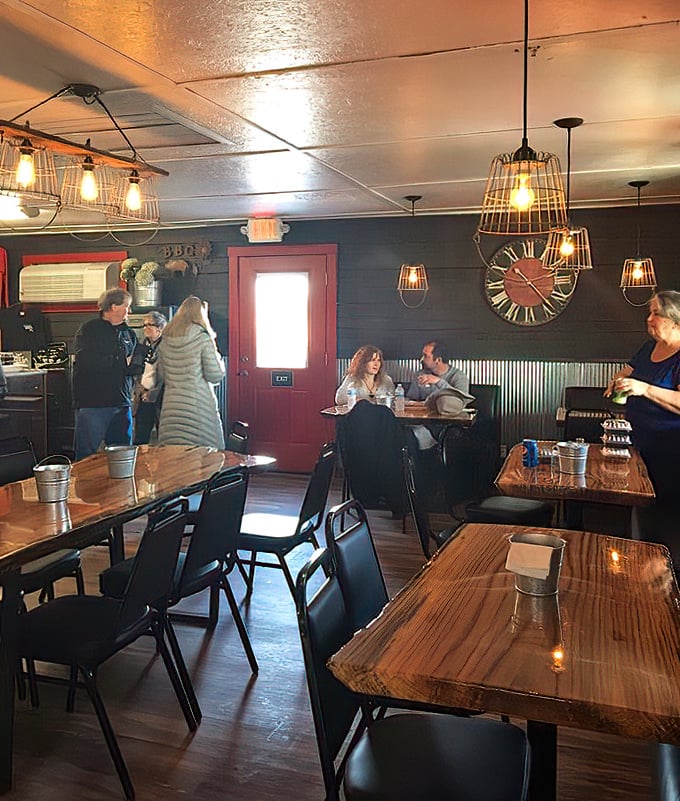 Rustic charm meets serious BBQ business inside. Those wire cage lights aren't just illuminating the space&mdash;they're spotlighting your next food memory.