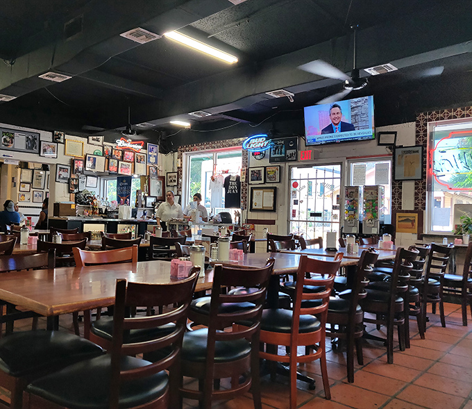 Wall-to-wall memories line the interior, where decades of satisfied customers have left their mark alongside televisions that nobody watches.