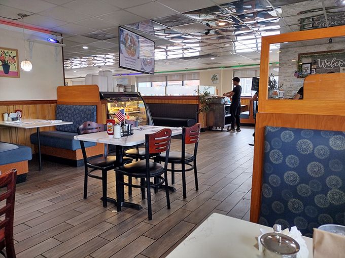 Step inside and you're greeted by that quintessential diner comfort &ndash; wooden booths, patterned upholstery, and the promise of hearty meals served without pretension.