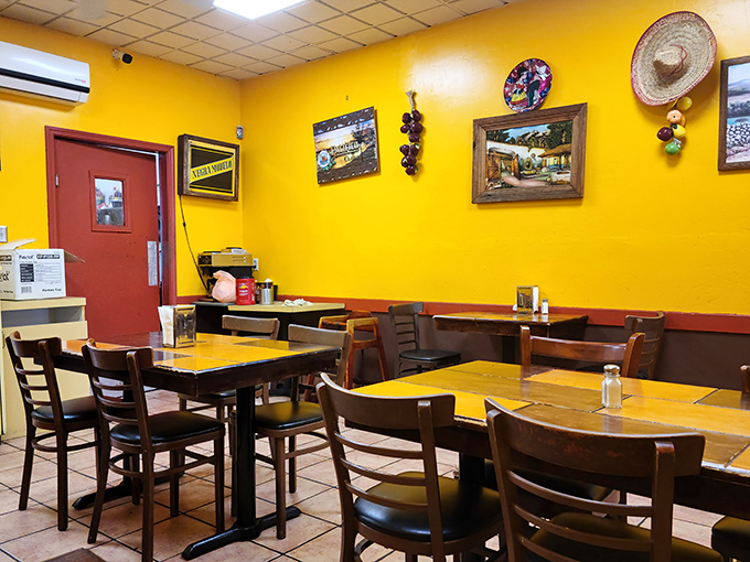 Sunshine yellow walls and simple wooden tables create the perfect backdrop for the flavor explosion that's about to happen on your plate.