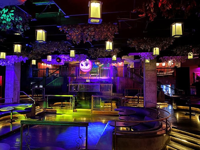 Purple hues and hanging lanterns create an enchanted forest where Burton's imagination comes alive.