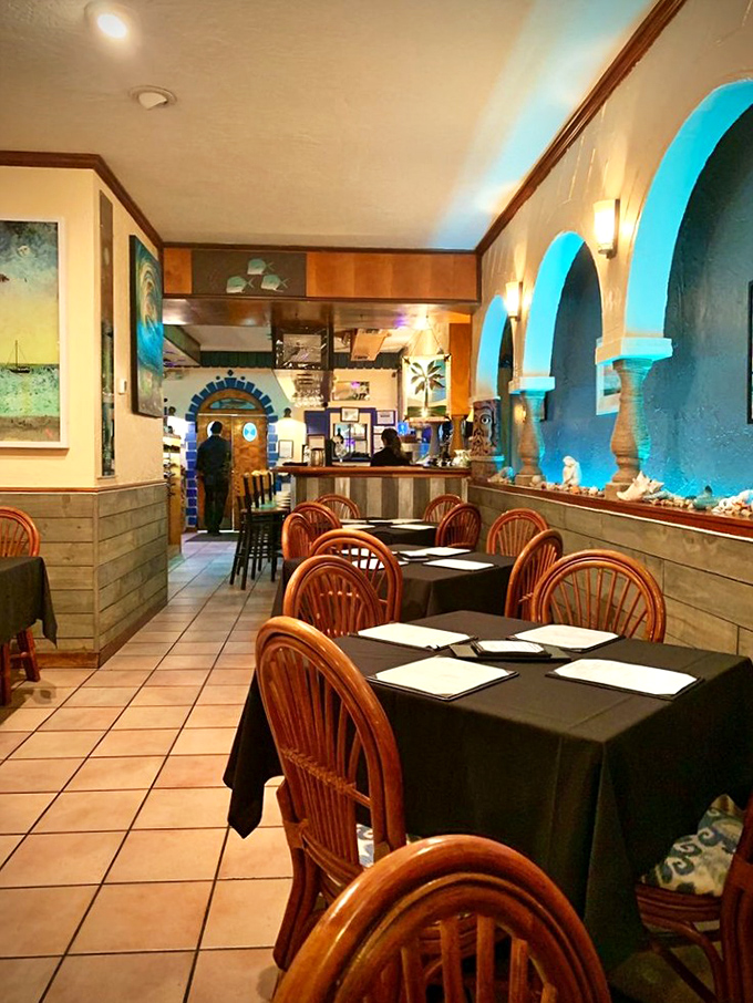 Blue-lit arches transform this dining room into an underwater fantasy, where seafood dreams come true without getting your feet wet.