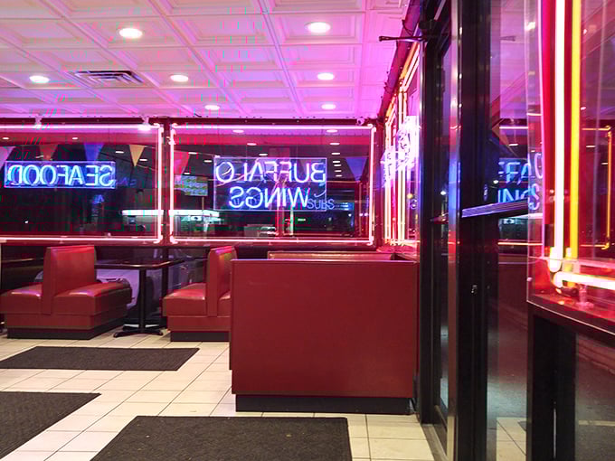 Bathed in the glow of neon signs, these red booths have witnessed countless first bites and the involuntary food dances that follow.