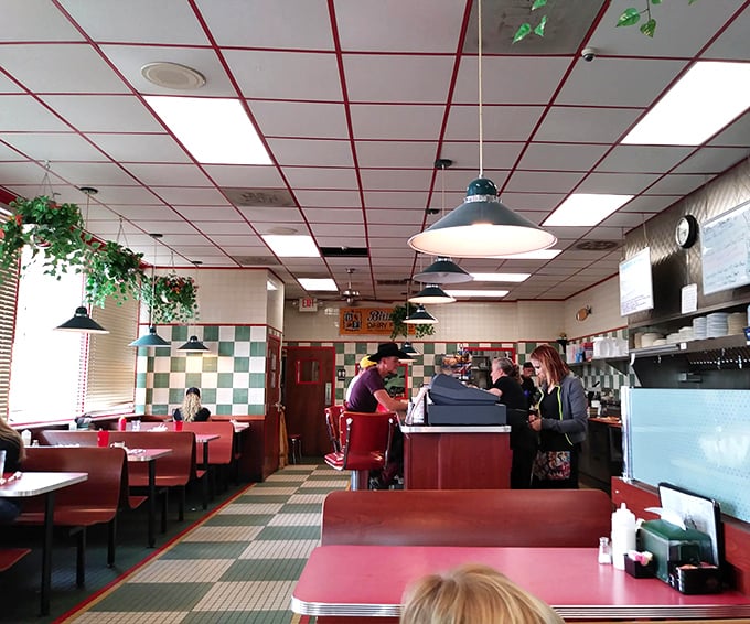 Classic checkerboard floors and red vinyl booths create the perfect backdrop for breakfast magic. This isn't retro-themed&mdash;it's authentically unchanged because it never needed improving.