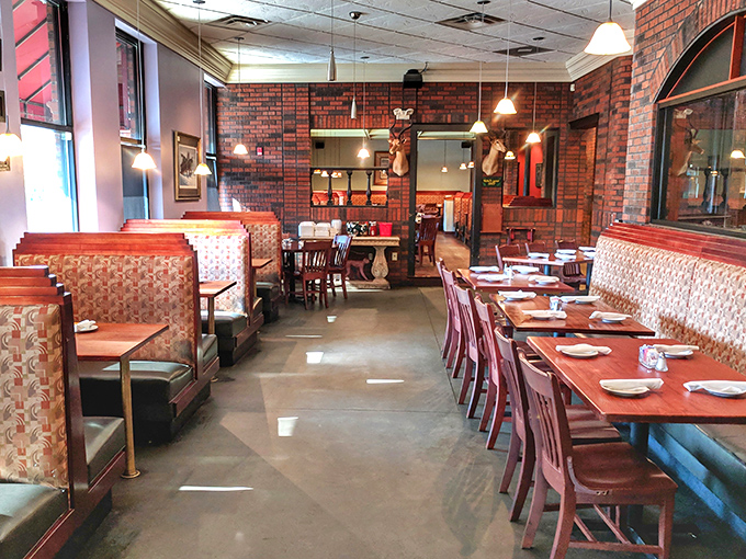Exposed brick walls and comfortable booths create that perfect "fancy but not too fancy" vibe where both date nights and family dinners thrive.