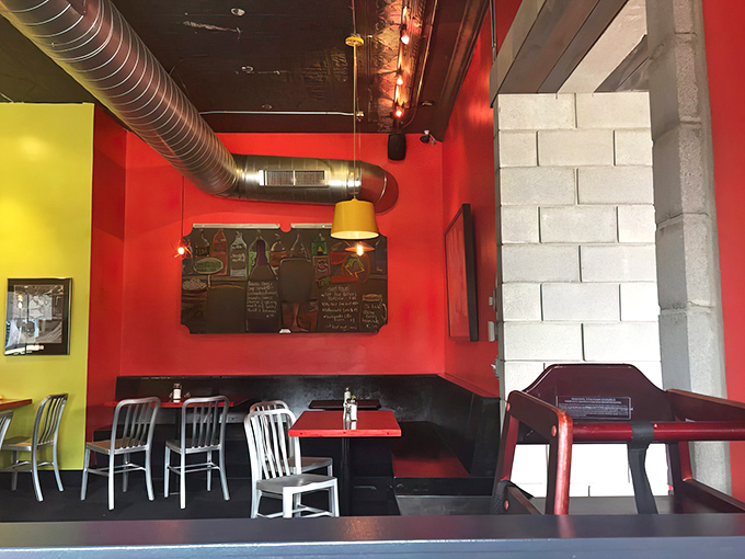 Industrial meets cozy inside with those vibrant red walls and exposed ductwork. The kind of place where comfort food gets the respect it deserves.