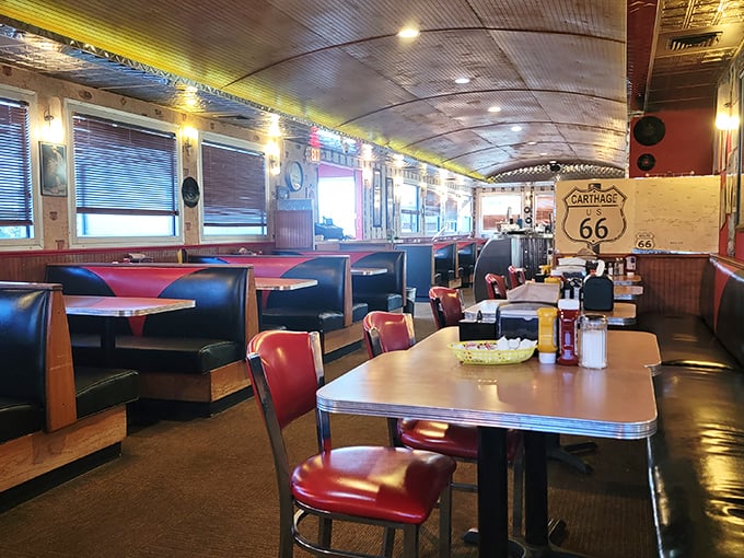 Red vinyl booths and Route 66 memorabilia create the perfect backdrop for comfort food conversations. This isn't decoration&mdash;it's diner DNA.