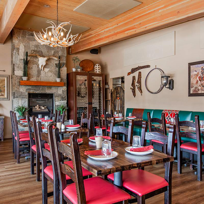 Antler chandeliers, stone fireplaces, and those vibrant red chairs &ndash; dining rooms don't get more "Sedona" than this cozy corner of cowboy heaven.