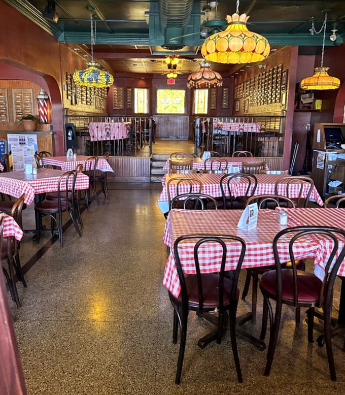 Red-checkered tablecloths and vintage lighting create the perfect backdrop for culinary memories. This isn't just dining&mdash;it's time travel with taste buds.