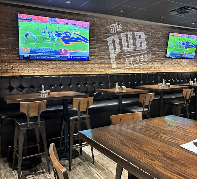 Exposed brick, leather booths, and strategically placed TVs create the perfect balance between sports bar energy and "I can actually hear my dinner companion" comfort.