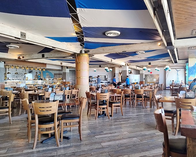 Blue and white ceiling drapes create a nautical dreamscape where the only thing more abundant than the seating is the seafood waiting to be devoured.