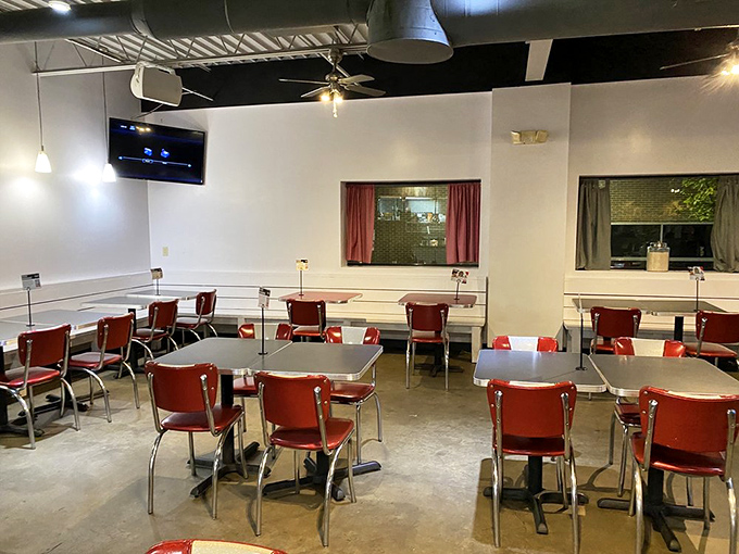 Classic red diner chairs invite you to settle in for comfort food nirvana, where conversations flow as freely as the coffee in this retro-modern space that feels like home, only with better food.