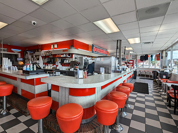 Welcome to the checkout frontier! Red carts await their mission while cashiers stand ready to transform your finds from "someone else's stuff" to "your prized possessions."