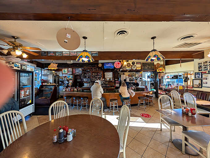 Step inside where Tiffany lamps meet comfort food in perfect diner harmony.