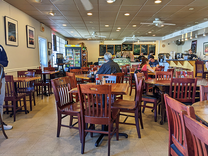 Warm wooden chairs and natural light create the kind of cozy atmosphere where you'll want to linger long after your coffee cup is empty.