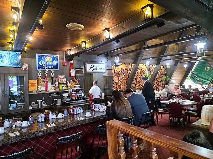 Rustic cabin vibes meet diner comfort in Country Way's wood-paneled interior. The log wall feature isn't just for show&mdash;it's storing enough breakfast energy to power a lumberjack convention.