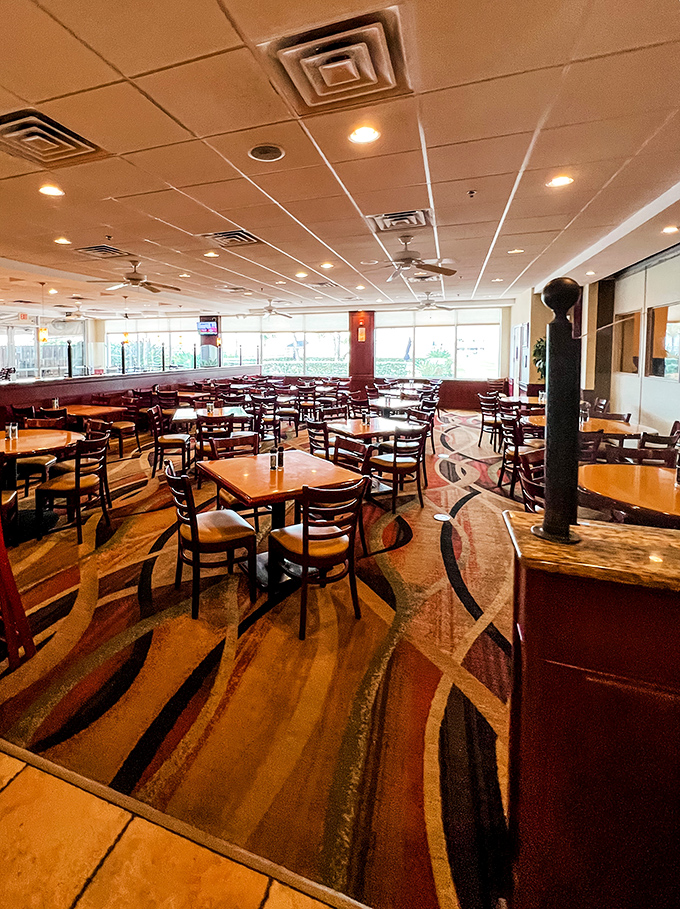 Inside Shuckers, warm wood tones and spacious seating create the perfect backdrop for seafood feasts and waterfront views.