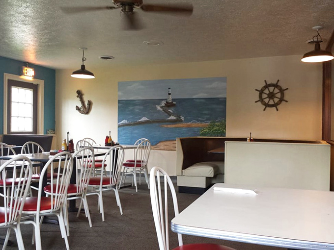 Nautical charm meets small-town comfort. That lighthouse mural isn't just decoration&mdash;it's foreshadowing the beacon of flavor this place has become.