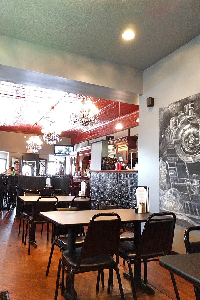 Step inside to discover elegant chandeliers hanging from a striking red tin ceiling&mdash;small-town Indiana meets unexpected sophistication.