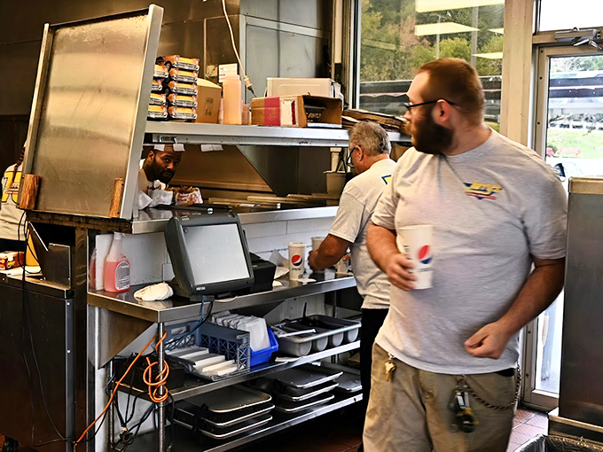 Behind the scenes magic happens at lightning speed, where decades of short-order expertise transforms simple ingredients into roadside classics.