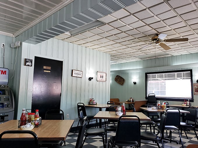 Mint-green paneled walls and classic checkered floors create the perfect backdrop for conversations that flow as freely as the coffee.