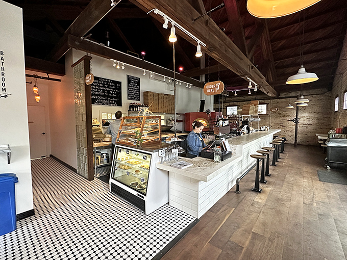 Step inside where exposed beams and warm lighting create the perfect backdrop for pizza perfection.