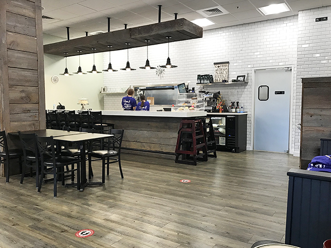 Rustic wooden accents meet clean white subway tile in this no-nonsense interior where the focus is squarely on the food, not fancy decor.