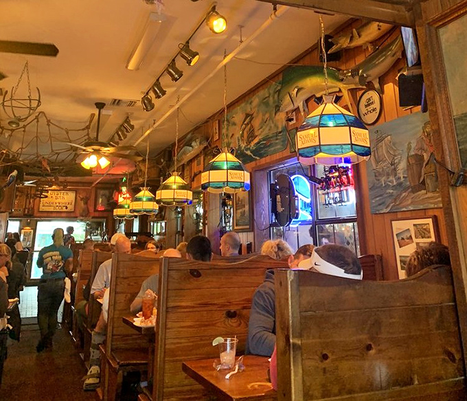 Inside, nautical dreams come to life with colorful stained glass lamps casting a glow that makes everyone look like they've just returned from vacation.