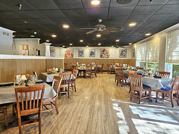 Inside, warm wood tones and nautical artwork create that perfect "coastal casual" vibe where you can relax without worrying if you're using the right fork.