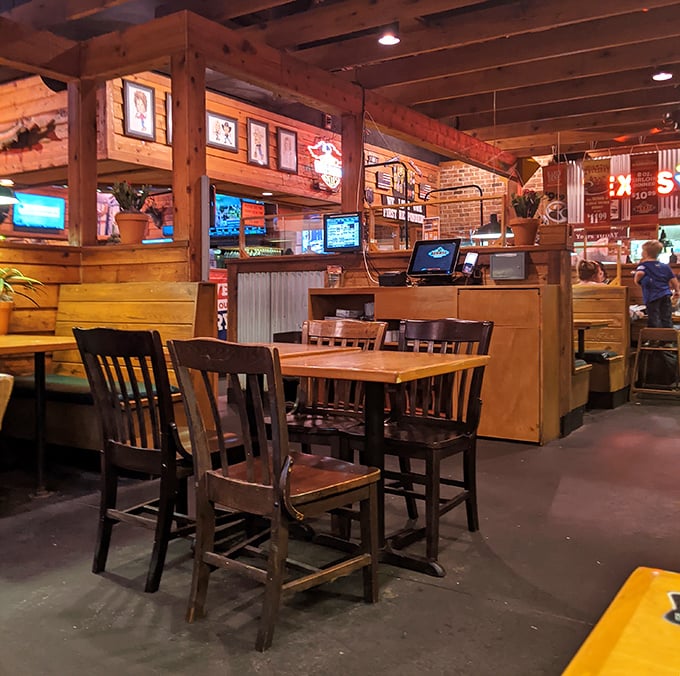 The warm glow of wood-paneled walls creates that perfect balance of "nice enough for date night, casual enough for Tuesday dinner."