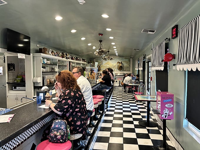 The classic black and white checkered floor and pink counter stools aren't retro by design&mdash;they're authentic survivors from a sweeter, simpler era.