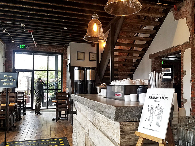 Where industrial chic meets cozy comfort. Exposed brick, wooden beams, and that staircase practically begging you to explore what's upstairs.