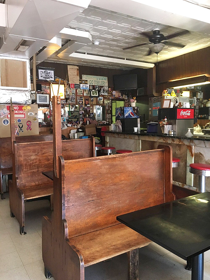 Step inside this cozy time capsule where wooden booths and memorabilia create the perfect chili dog sanctuary.
