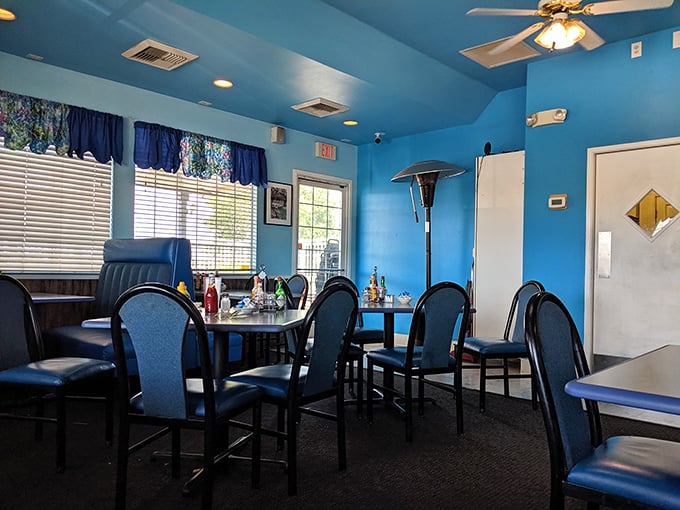 Bright blue walls create a cheerful oasis where comfort meets casual dining. This isn't designer chic&mdash;it's genuine California cafe warmth.