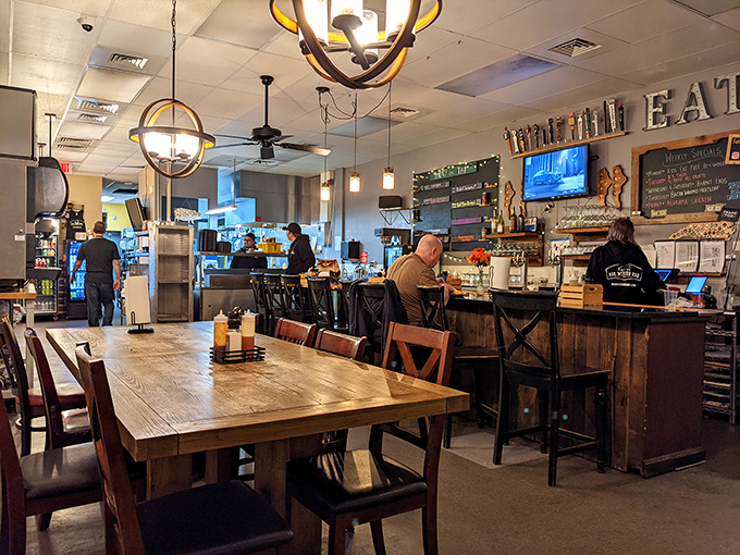 Rustic wooden tables, globe lighting, and that "Drink + Eat" sign sum up everything you need to know about your mission at Big Mike's.
