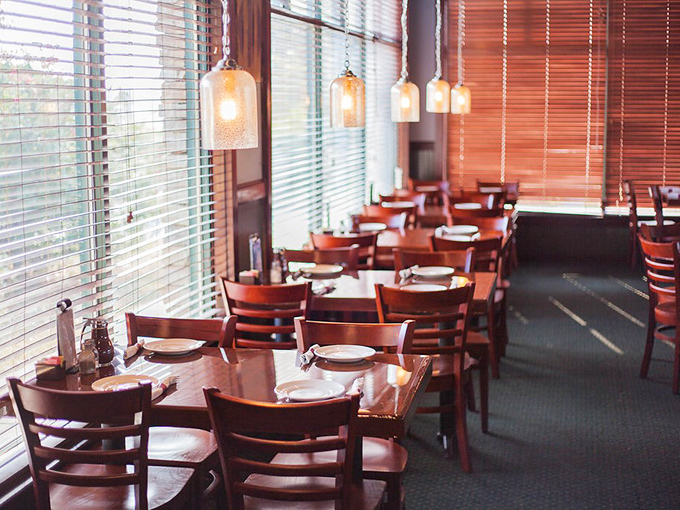 Warm wooden tones, ladder-back chairs, and pendant lighting create that rare dining atmosphere where both first dates and family reunions feel equally at home.