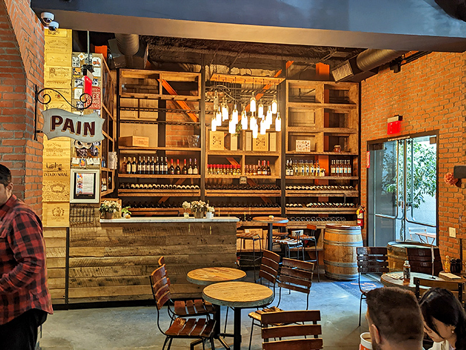 Exposed brick, wooden accents, and wine bottles galore&mdash;this isn't just a bakery, it's a French escape where time slows down deliciously.