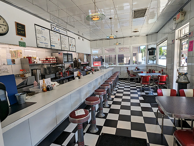 Classic Americana at its finest &ndash; a checkerboard floor, gleaming counter, and red vinyl stools where countless coffee cups have been refilled since Eisenhower was president.