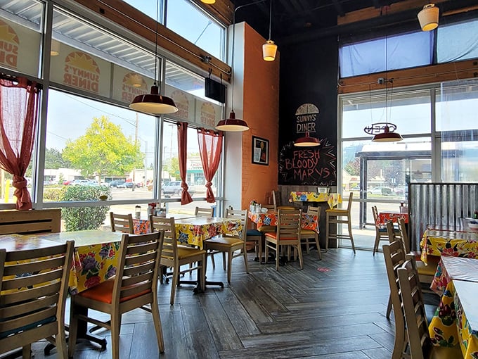 Wooden floors, colorful tablecloths, and those pendant lights create the perfect backdrop for the breakfast drama about to unfold on your plate.