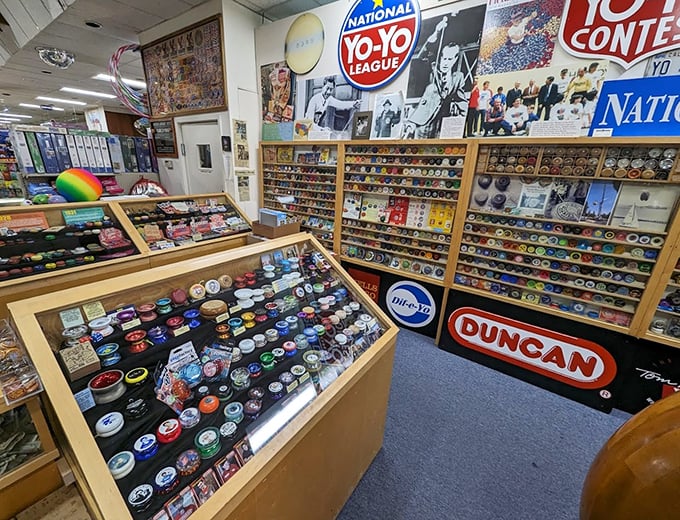 A kaleidoscope of yo-yos fills every inch of display space. Like a candy store for nostalgia addicts, each shelf tells a different chapter in spinning history.