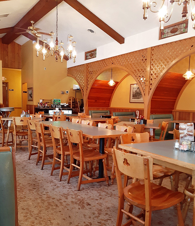 Step into this warm, wood-paneled haven where chandeliers meet comfort food in perfect harmony.