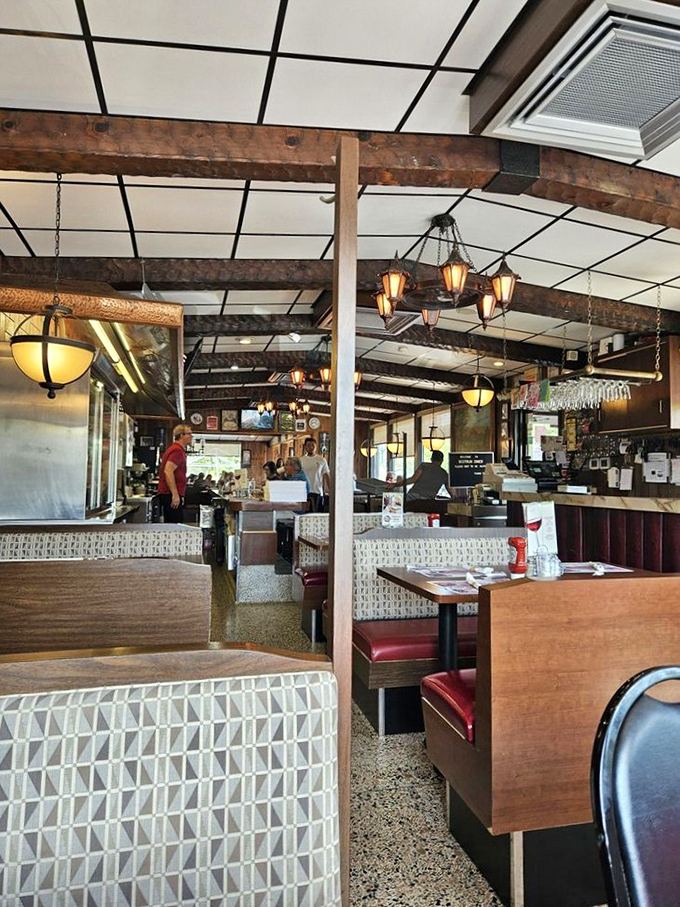 Step inside and time stands still – wooden beams, vintage lighting, and those unmistakable booths where countless stories have unfolded over coffee refills.