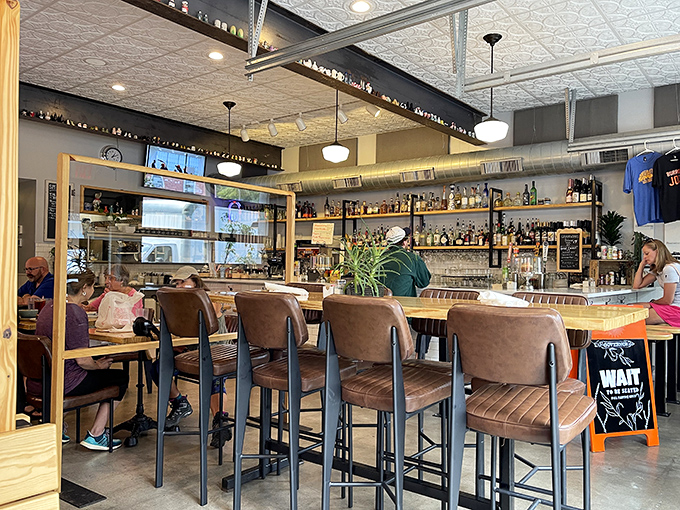 Pull up a chair at the well-stocked bar where comfort meets craft. The warm wood tones and cozy seating invite you to linger longer.