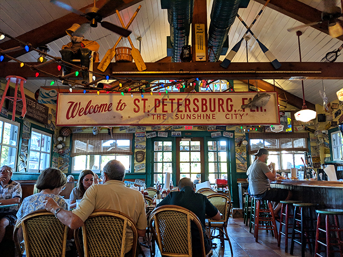 Colorful string lights, fishing nets, and that iconic "Welcome to St. Petersburg" sign create the perfect backdrop for seafood that doesn't need fancy surroundings to shine.