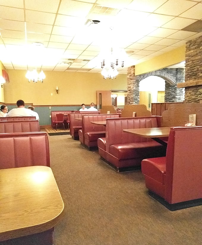 Classic burgundy booths and stone archways create that perfect "come as you are" atmosphere where conversations flow as freely as the coffee.